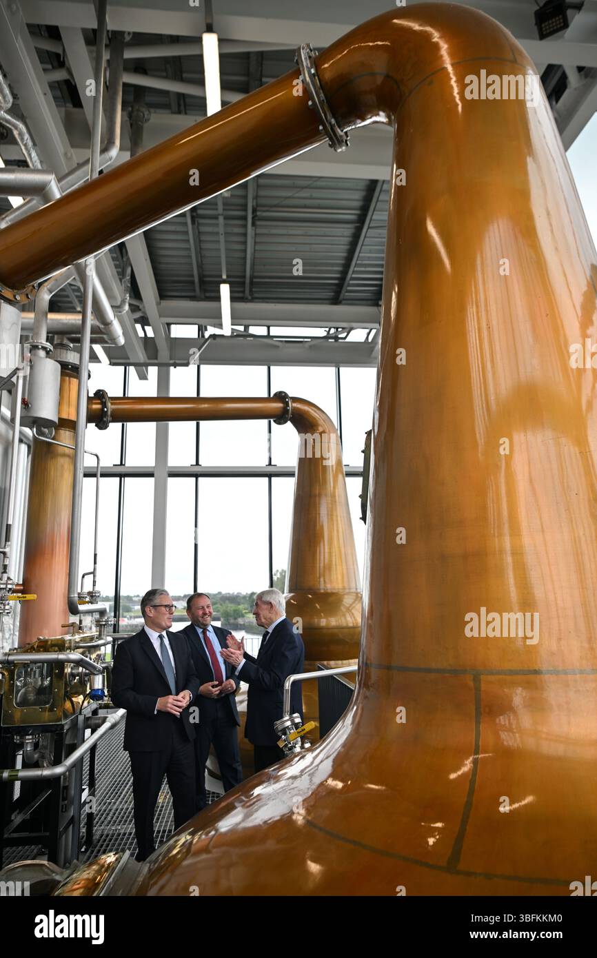 Prime Minister Sir Keir Starmer (left) listens to Clydeside Distillery ...