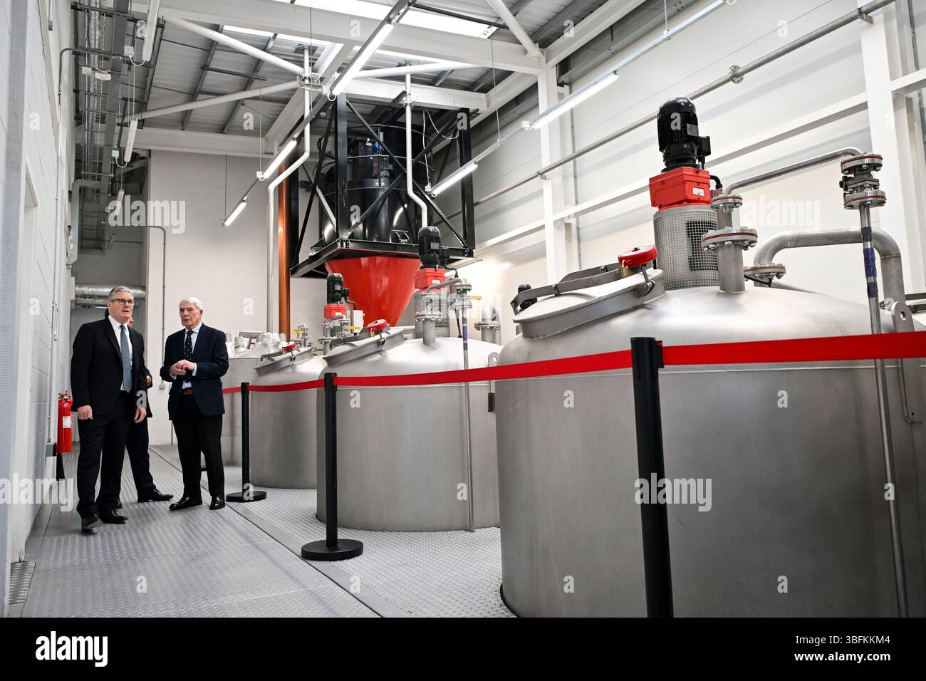 Prime Minister Sir Keir Starmer listens to Clydeside Distillery ...