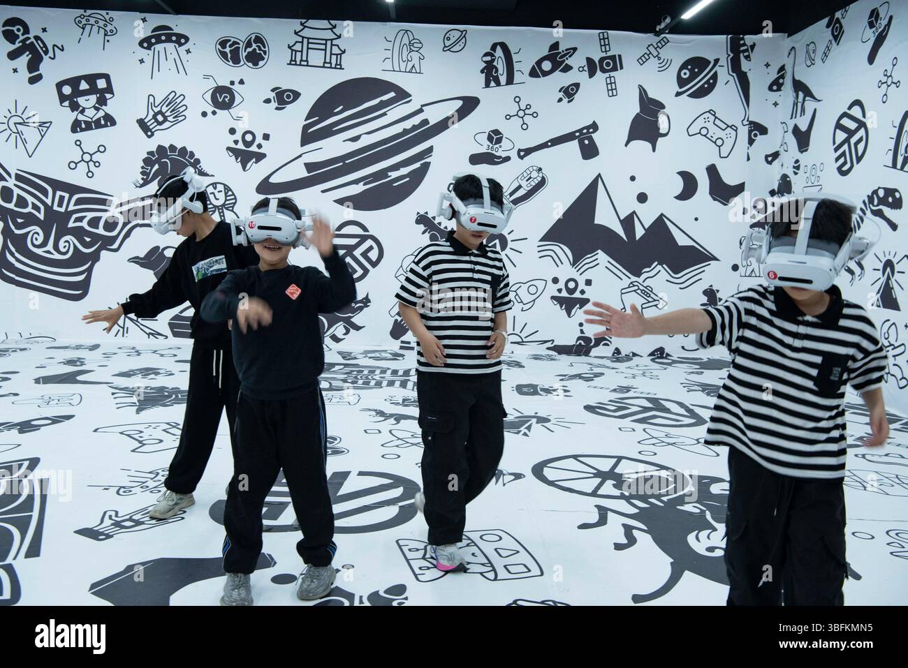 HAIAN, CHINA - JUNE 2, 2025 - Children are experiencing in a VR ...