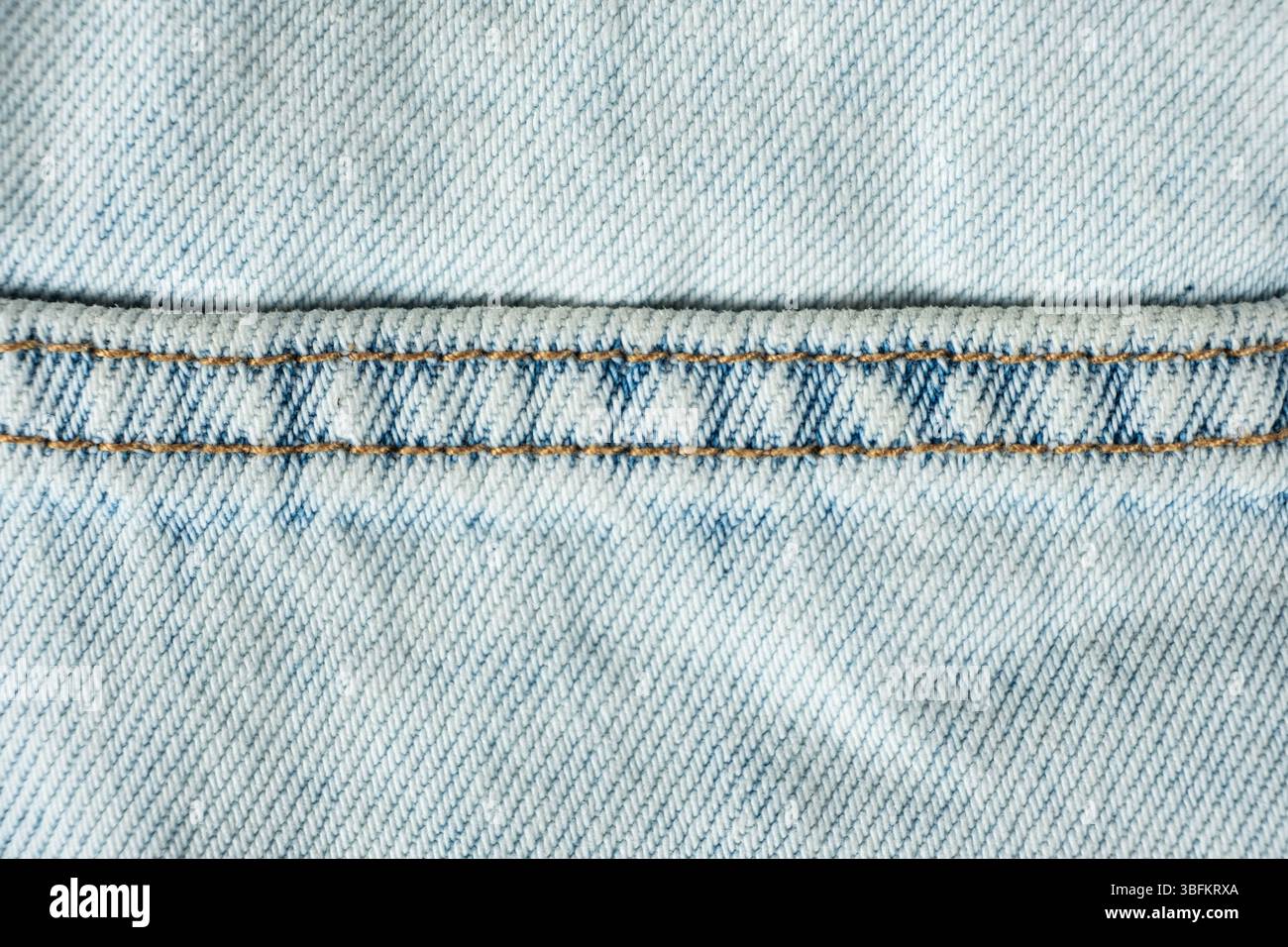 Detailed View of Blue Jeans Fabric and Yellow Thread Stitching Stock ...