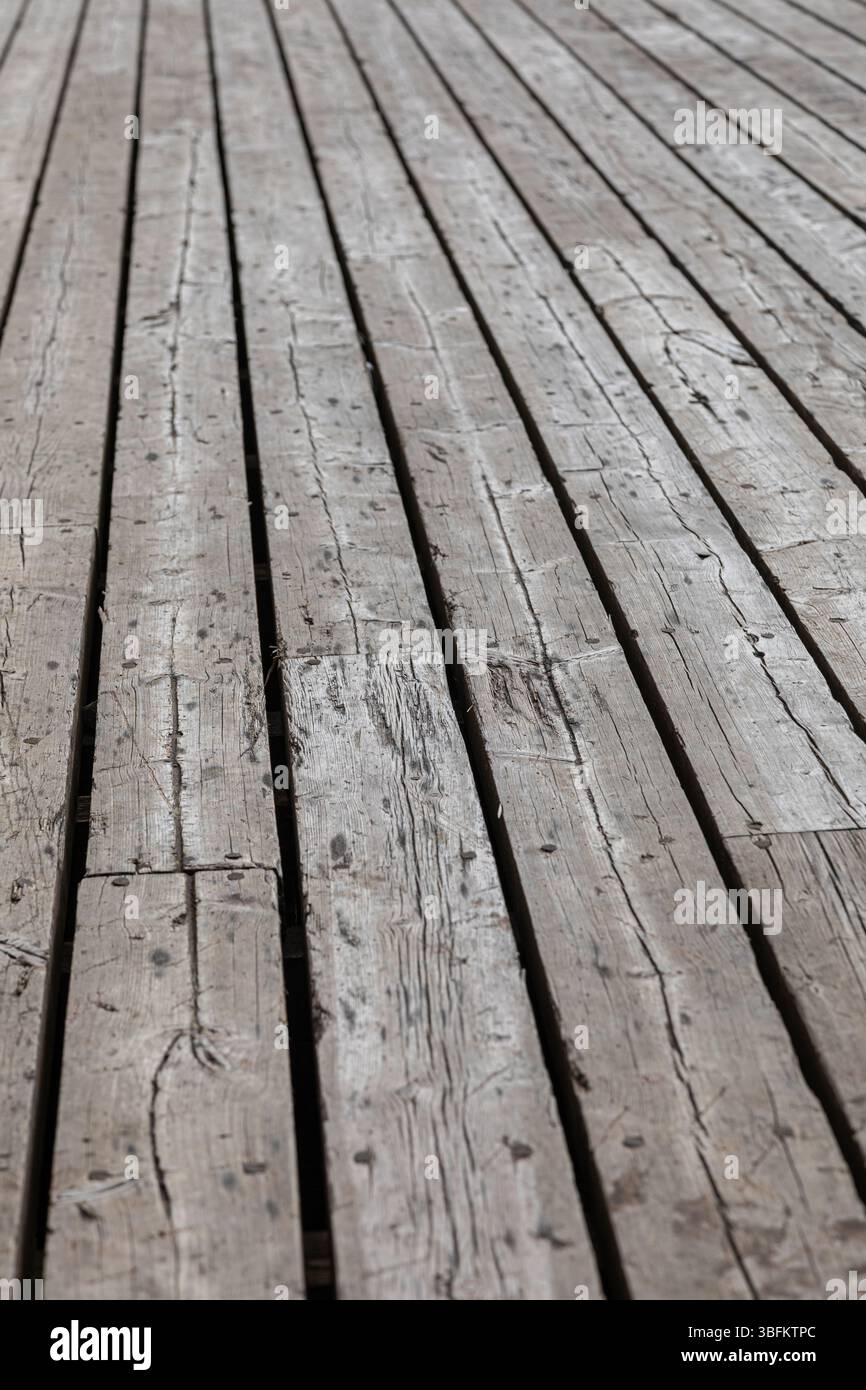 Vertical view of rustic wooden planks with nails and grain ...