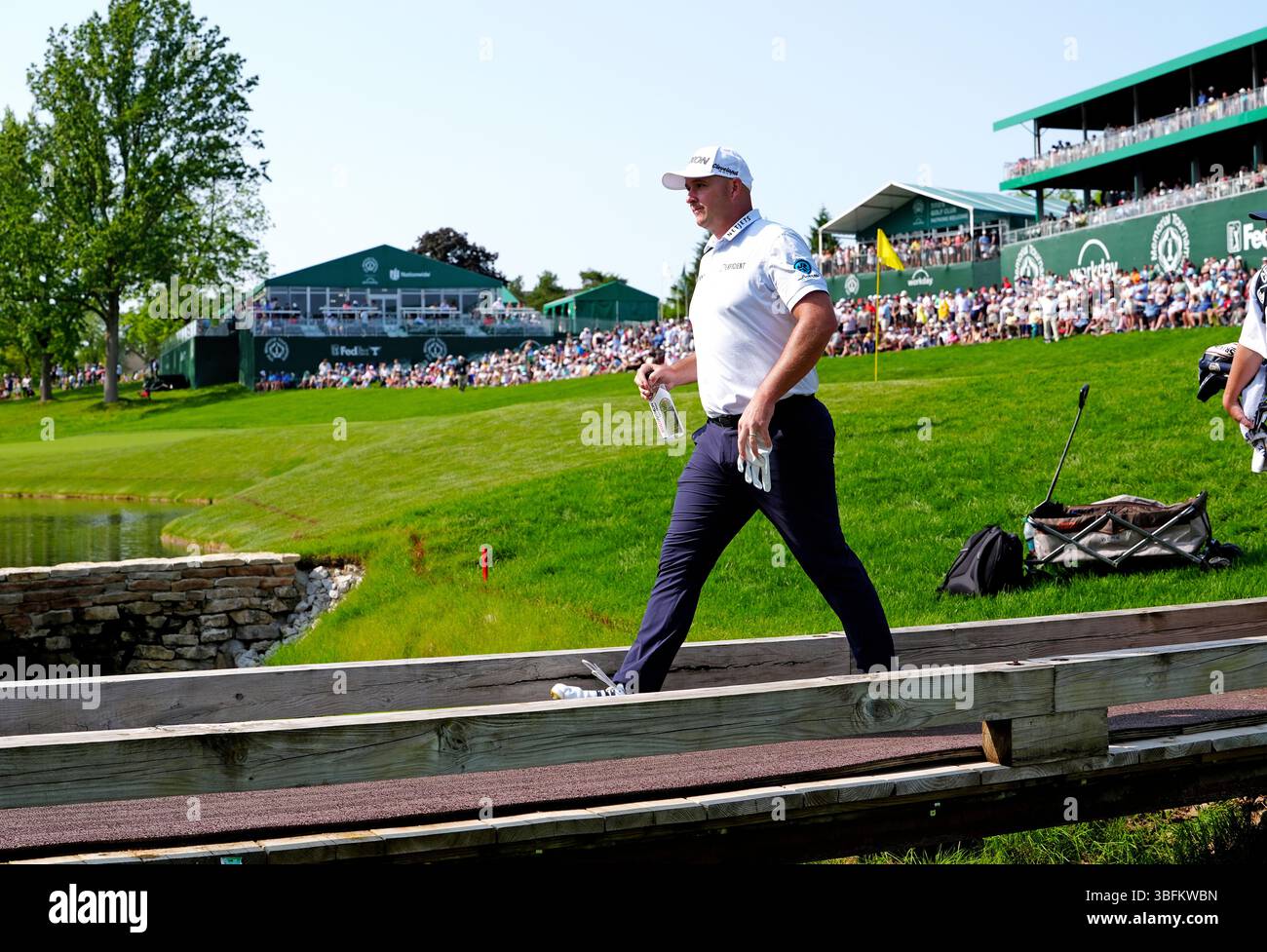 DUBLIN, OH - JUNE 01: PGA golfer Sepp Straka walks across a bridge on ...