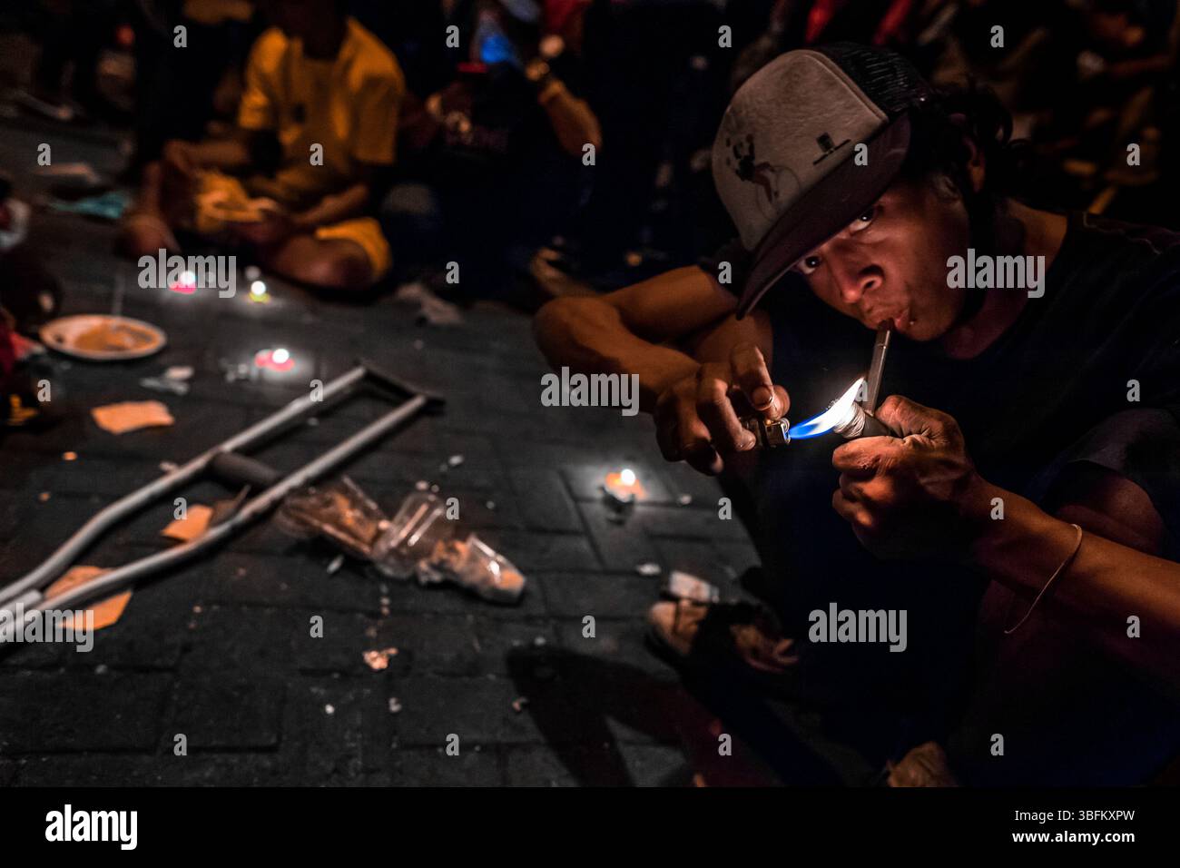 A Colombian drug user smokes basuco – an unrefined, dirty cocaine paste ...