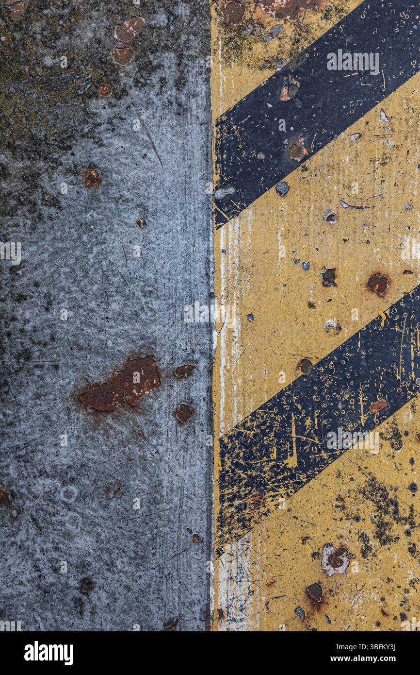 Close-up of weathered industrial machine detail with yellow-black ...