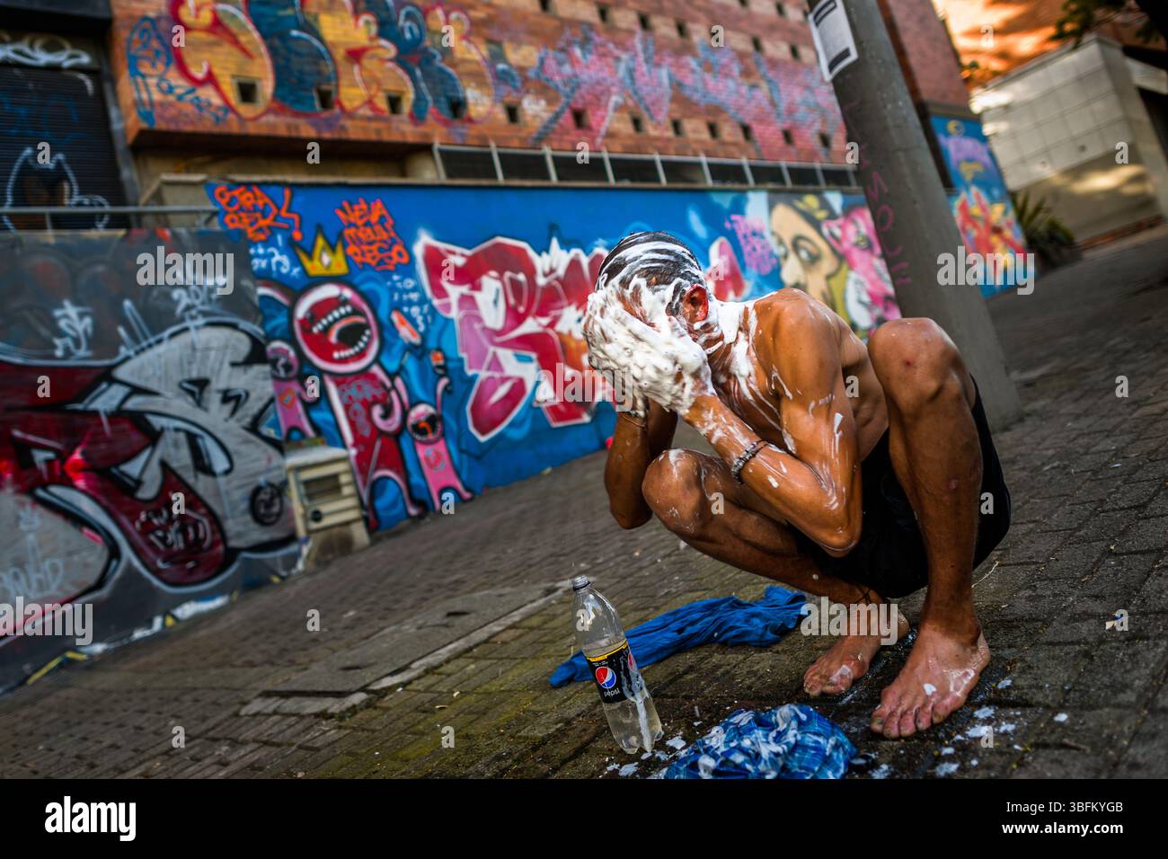 A Colombian drug user carries out personal hygiene and washes his ...