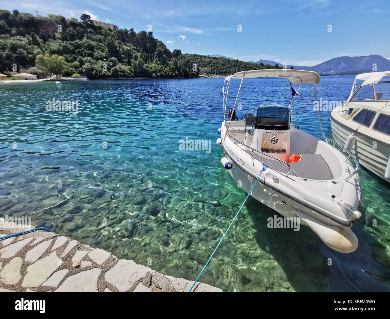 Spilia harbour, beach and bay below Spartochori village on Greek island ...