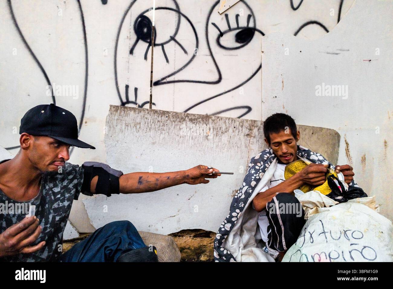 A Colombian drug user shares a pipe of basuco – an unrefined, dirty ...