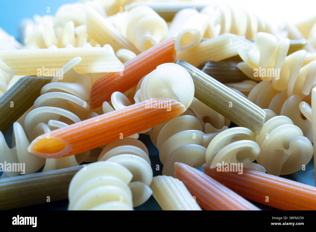 food concept, tricolor dry pasta mix Stock Photo - Alamy