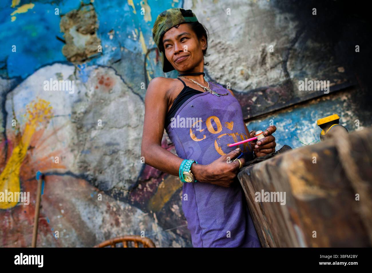A Colombian drug user, intoxicated after smoking basuco – an unrefined ...