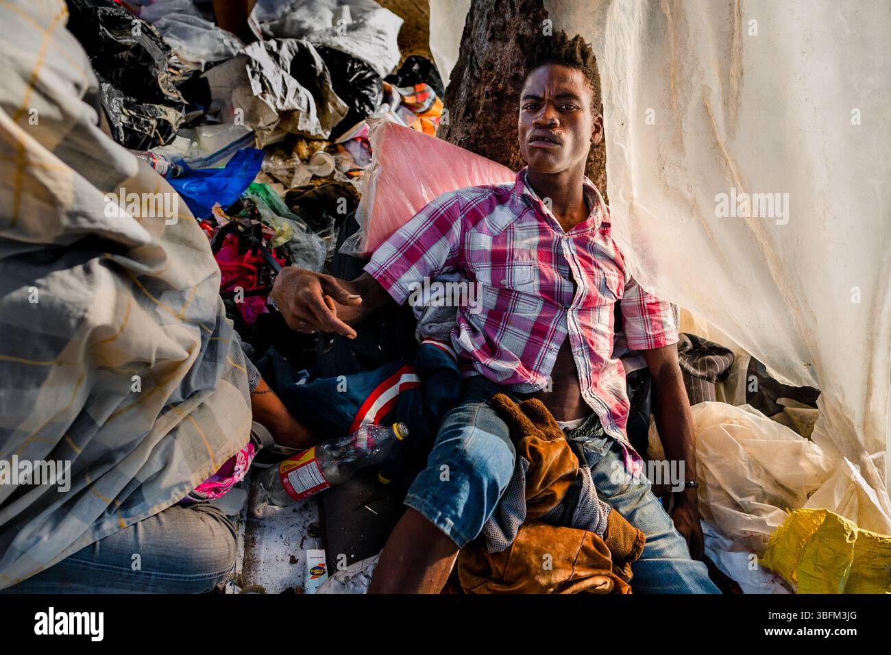 A Colombian drug user, intoxicated after smoking basuco – an unrefined ...
