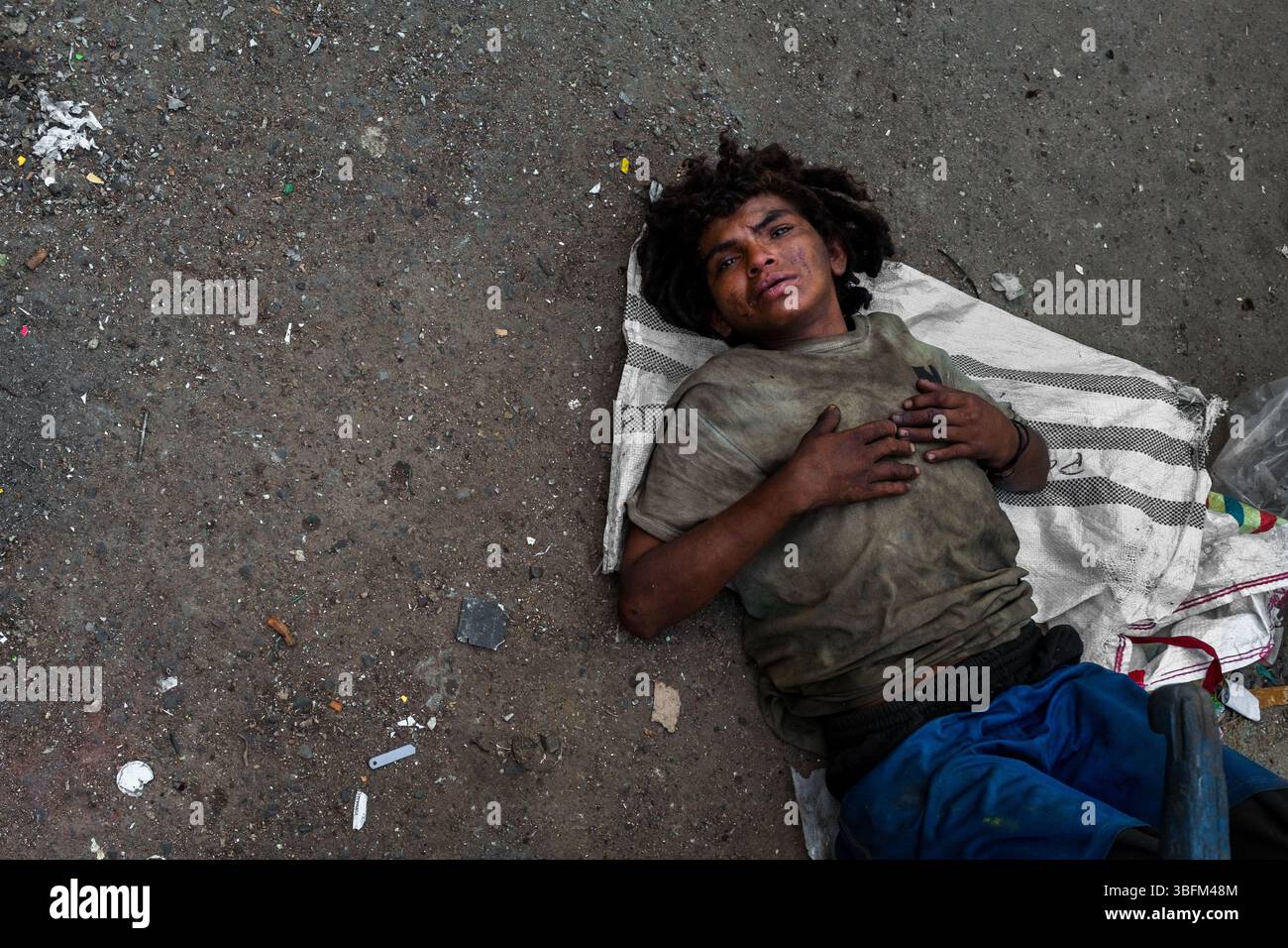 A Colombian drug user, intoxicated after smoking basuco – an unrefined ...