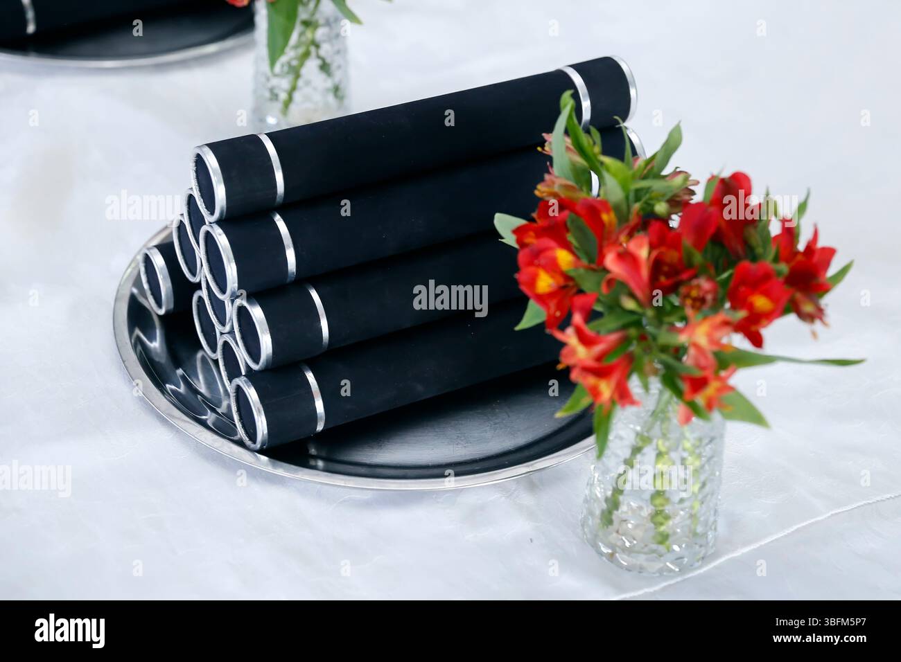 graduation, multiple certificates stacked at graduation ceremony ...