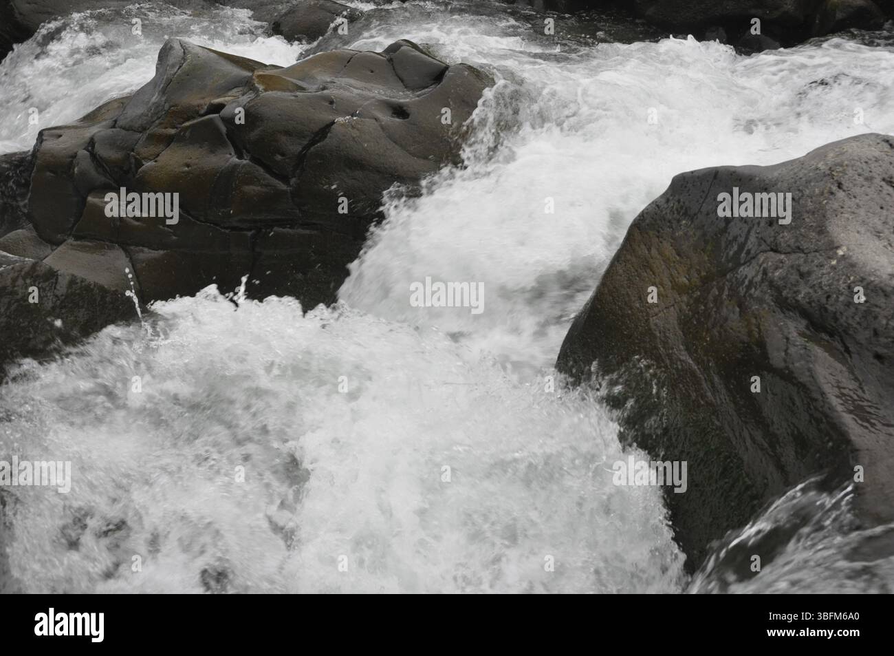 Flowing river with whitewater rapids over rocks, The Alcantara Park is ...