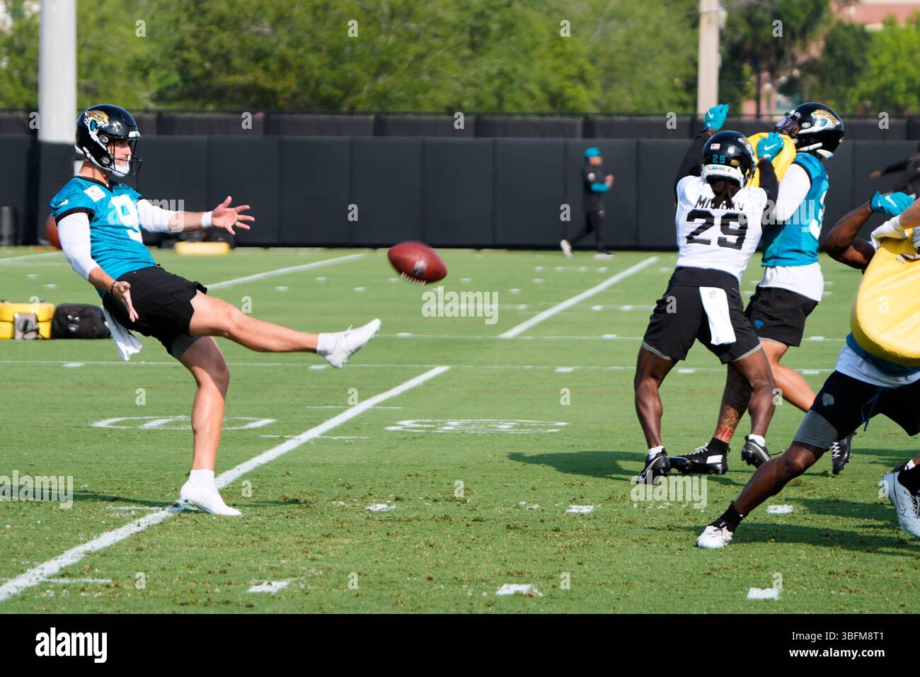 Jacksonville Jaguars punter Logan Cooke (9) punts during a team NFL ...