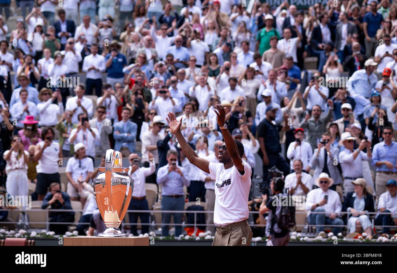 Ousmane Dembele of PSG presents the Champions League Trophy to the ...