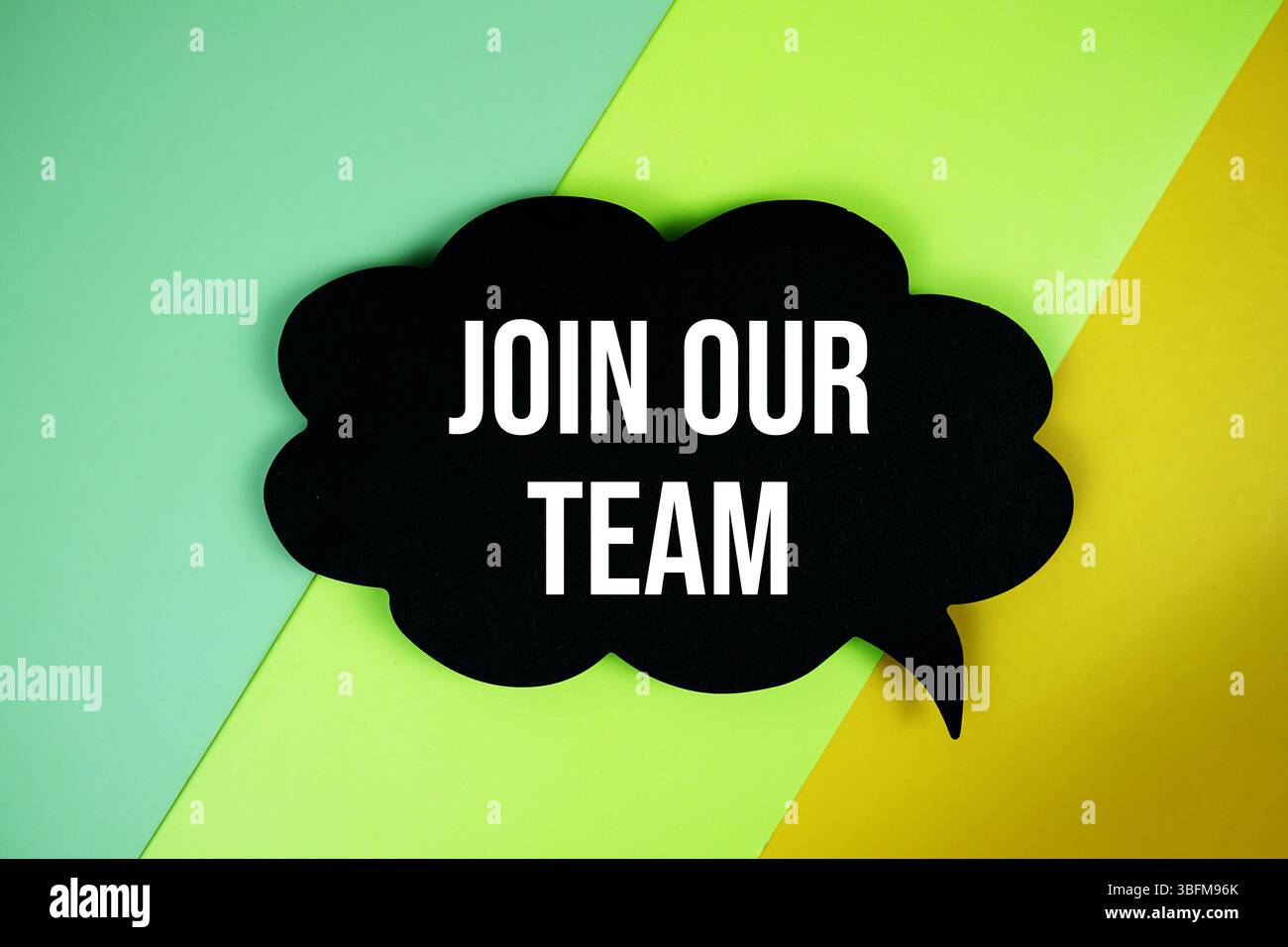 Join Our Team text on speech bubble top view on green and yellow ...