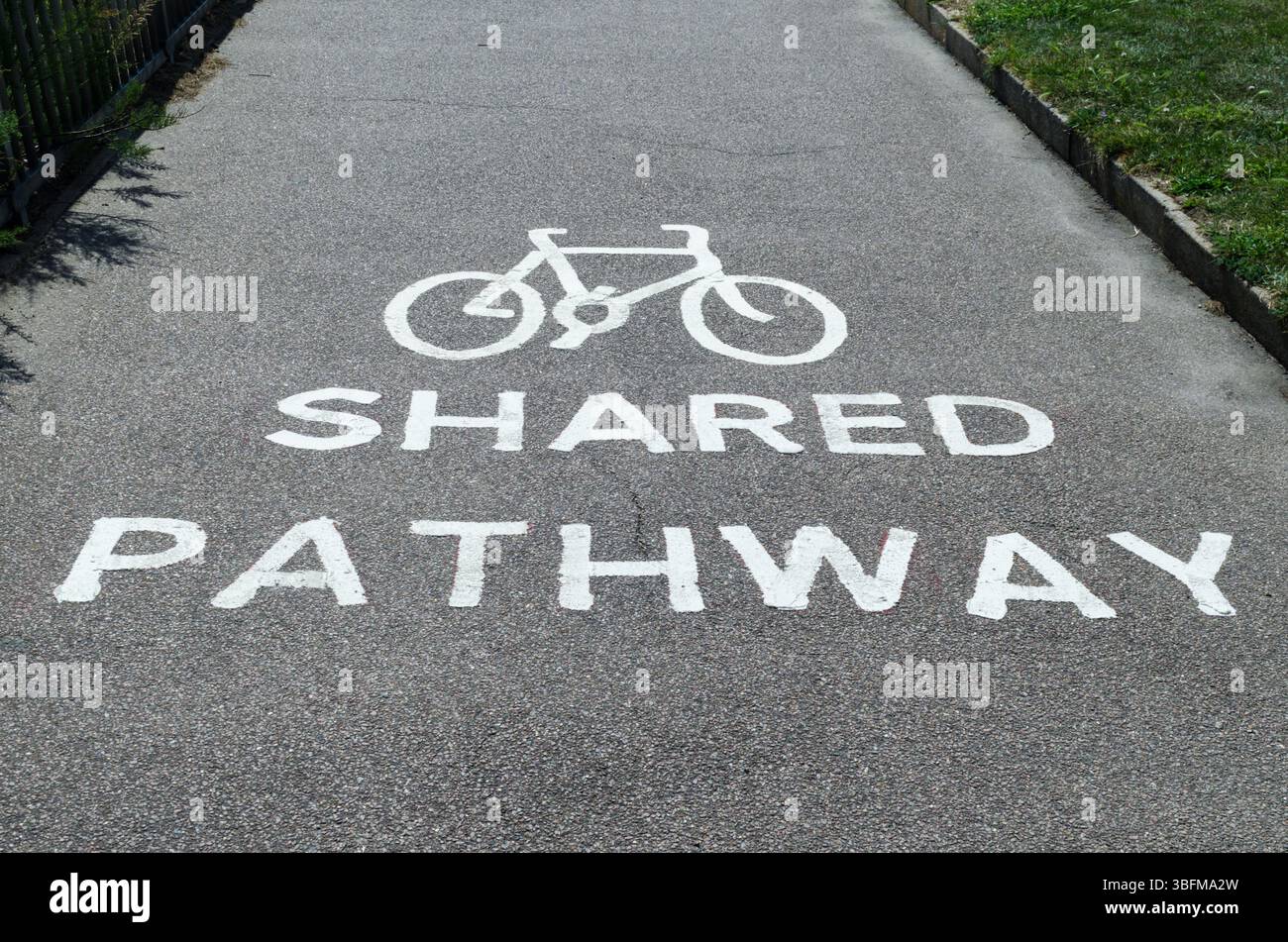 Cycle path symbol on a asphalt path in British Stock Photo - Alamy