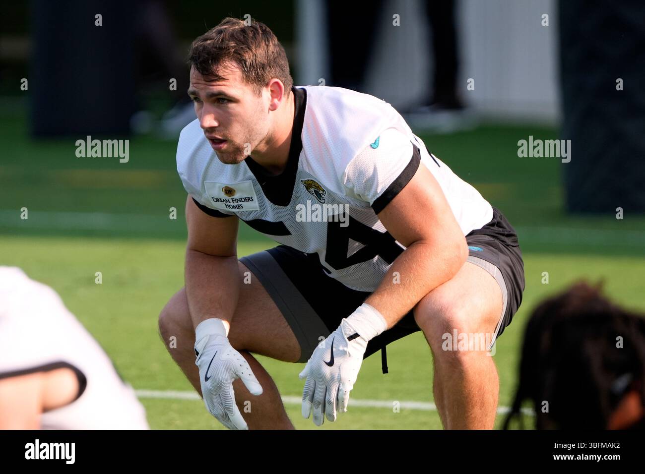 Jacksonville Jaguars linebacker Jack Kiser warms up with teammates ...