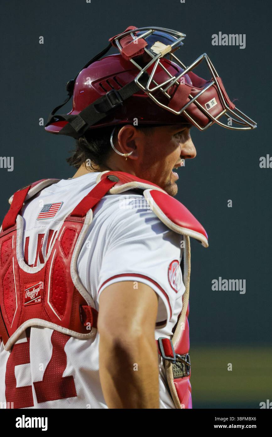 June 1, 2025: Arkansas catcher Ryder Helfrick (27) lifts his mask to ...