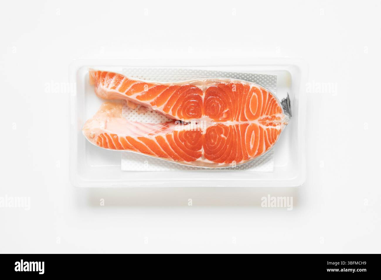Salmon in plastic packaging on white background, chilled fish Stock ...