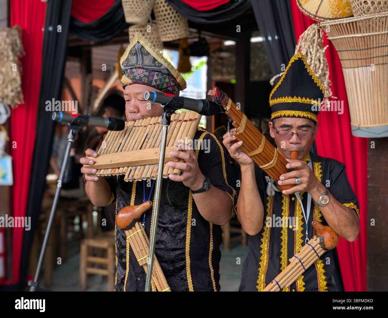 Kota Kinabalu, Sabah, Malaysia - May 30, 2025: Men blowing Sompoton and ...