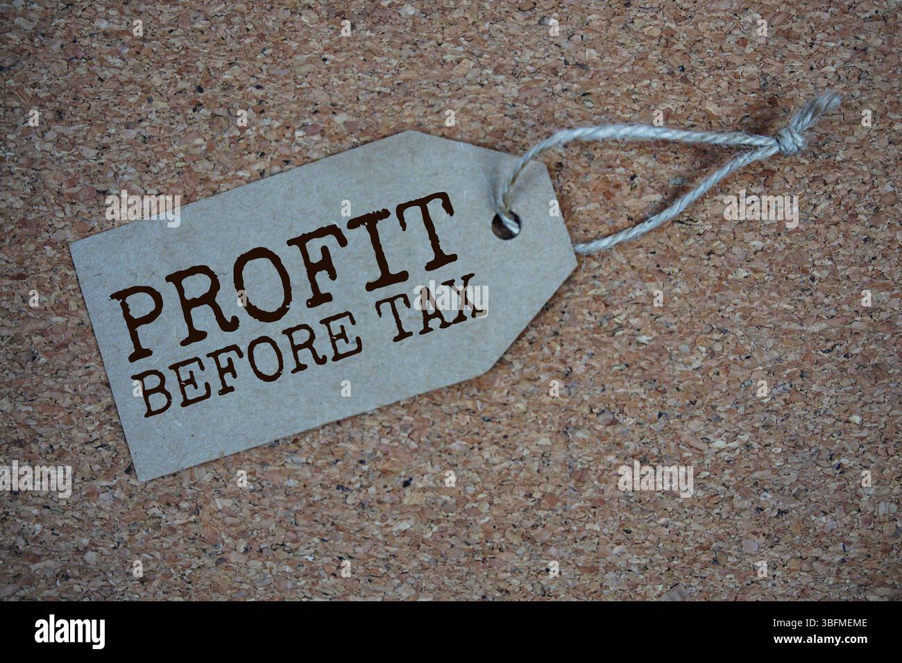 Profit Before Tax text on price tag top view on cork paper background ...