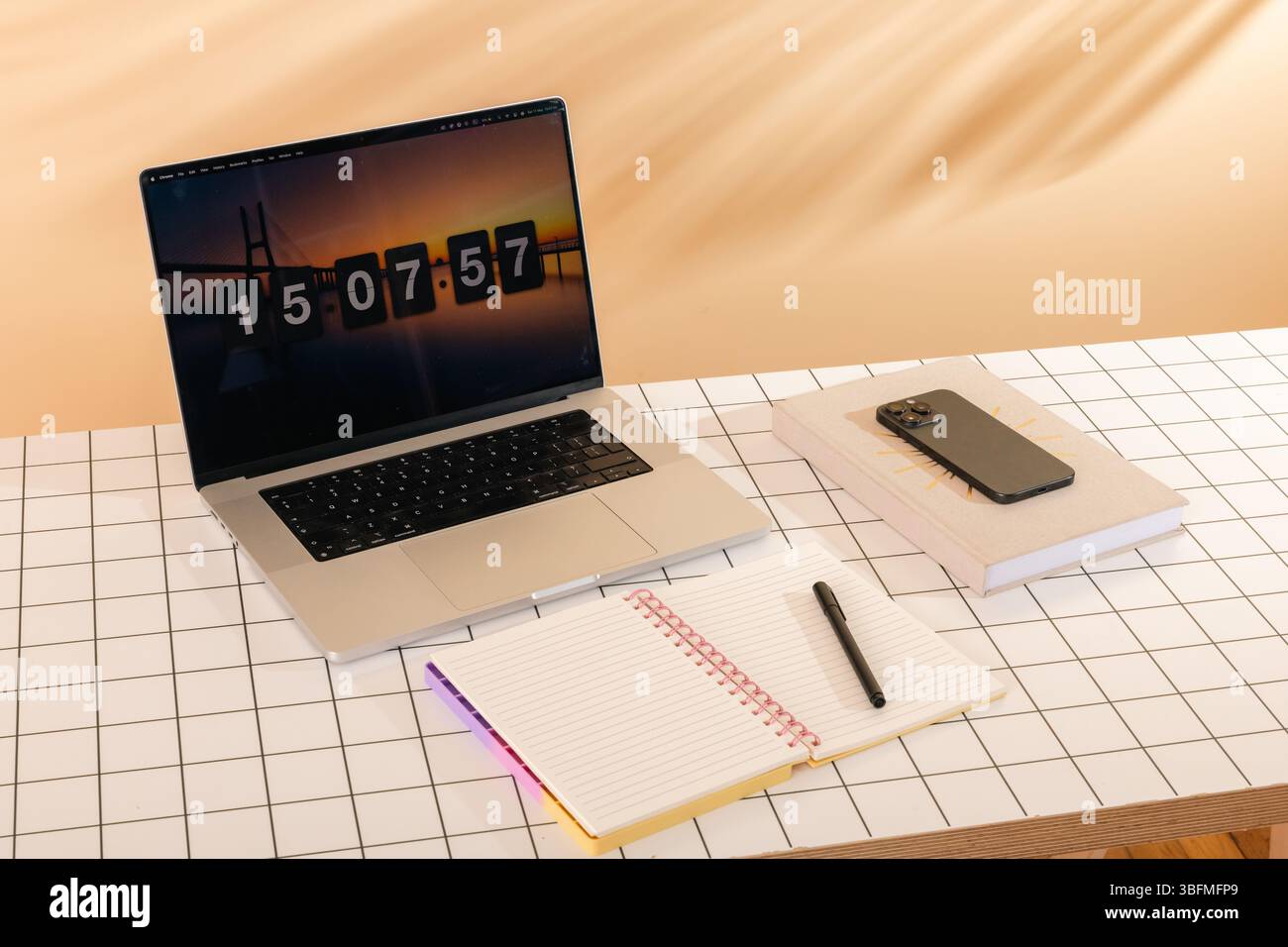 Comprehensive desk setup featuring a laptop displaying a countdown ...