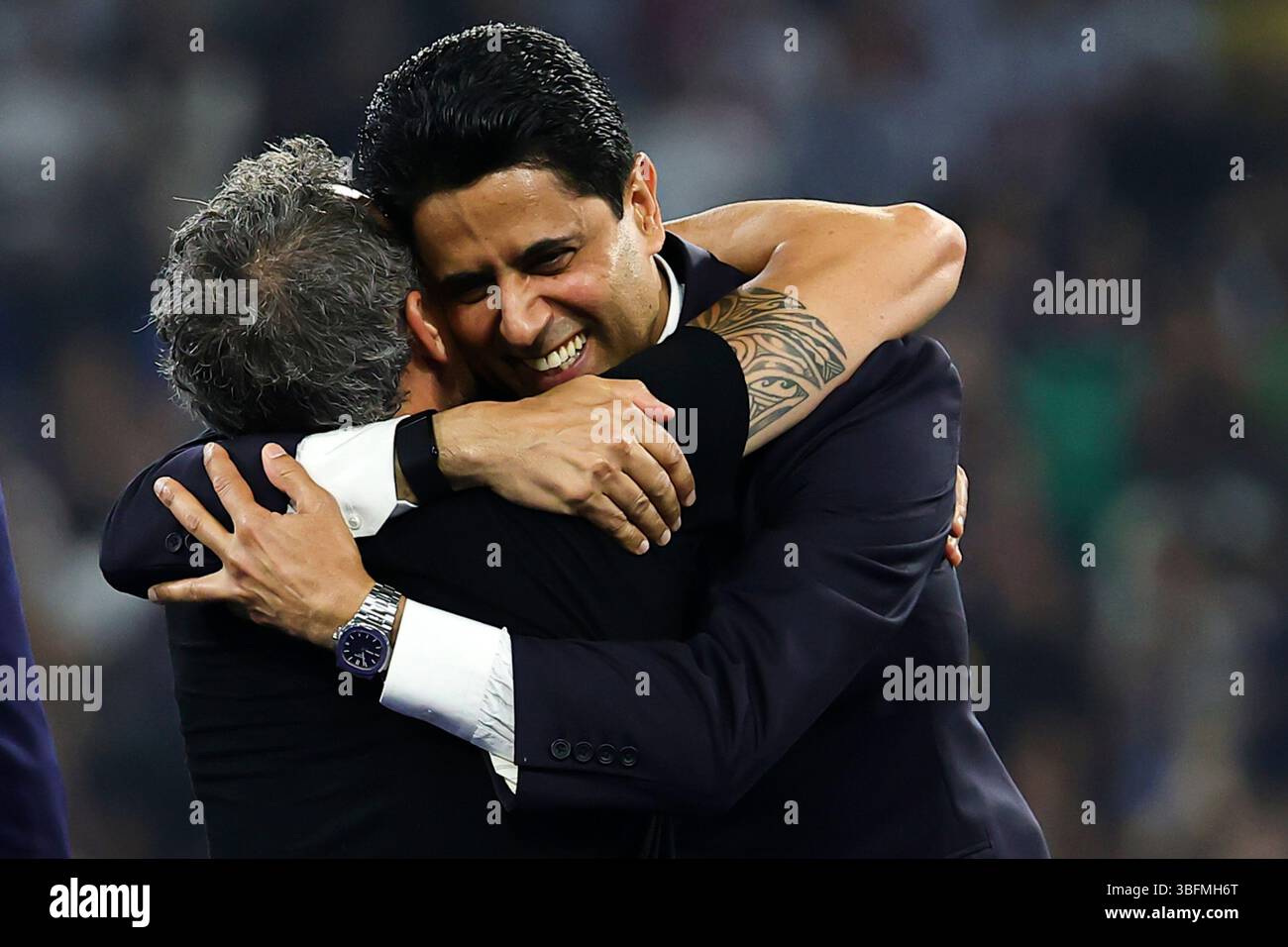 PSG president Nasser Al-Khelaifi (r) hugs Luis Enrique head coach of ...