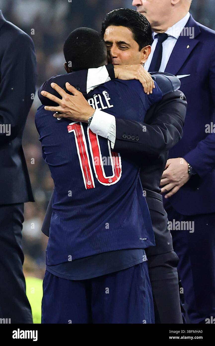 PSG president Nasser Al-Khelaifi (r) hugs Ousmane Dembele as they ...