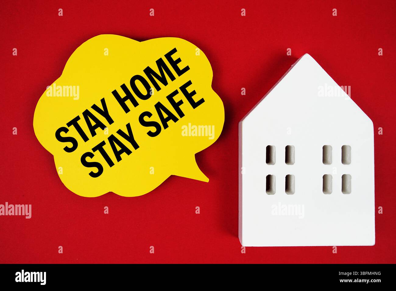 Stay Home Stay Safe text message on speech bubble with house model on ...