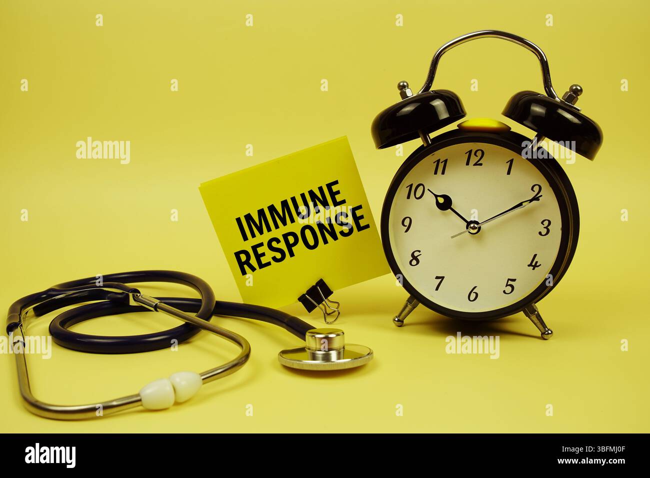 Immune Response text message on paper card with stethoscope and alarm ...