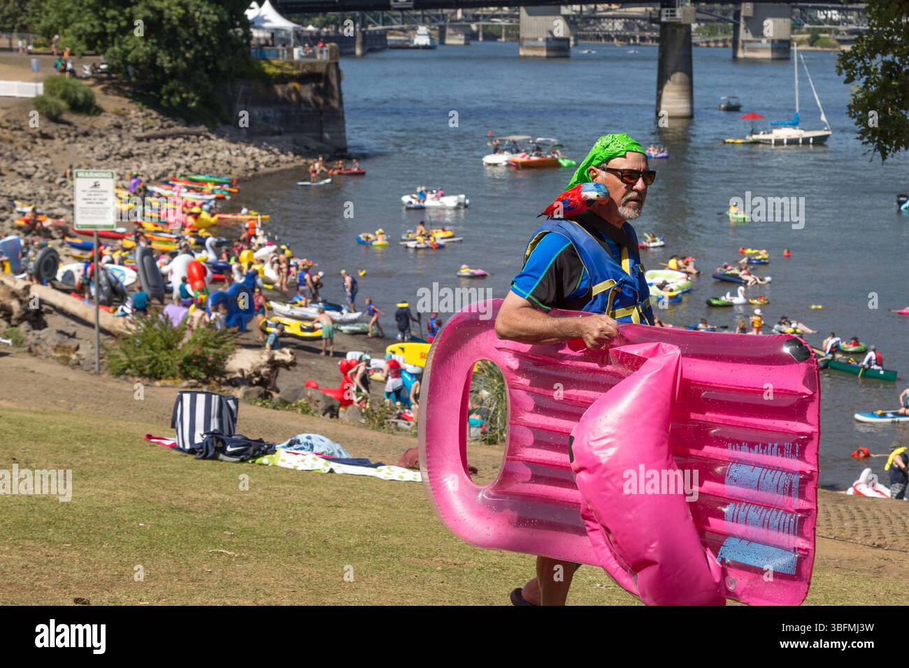The Big Float, Portland, Oregon - July 15th 2017: A man with a parrot ...