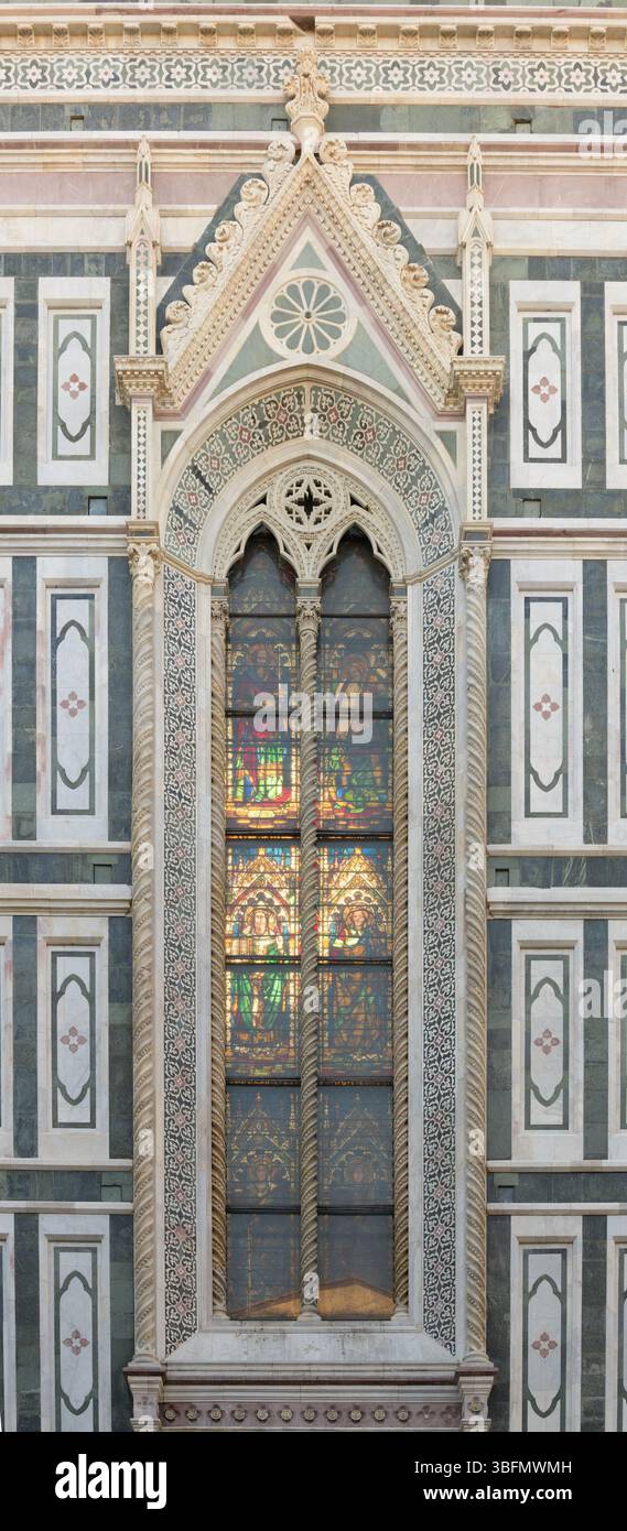 Stained glass window with Gothic tracery and marble frame on the Neo ...