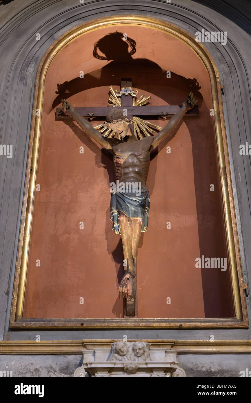 14th-century wooden crucifix with gilded rays, Gothic style, located in ...
