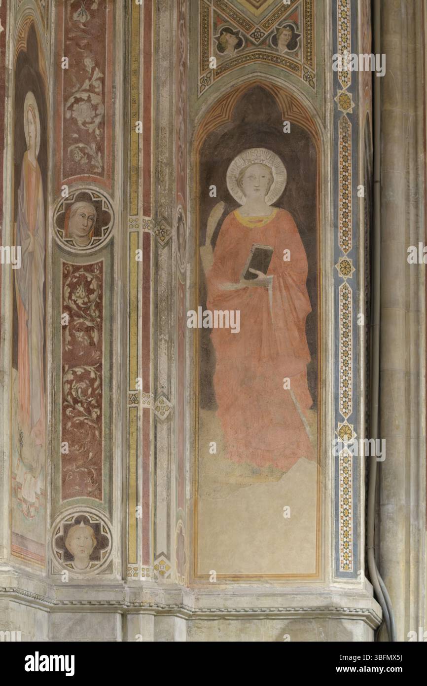 Fresco of a female saint with book and halo in a Gothic niche, 14th ...