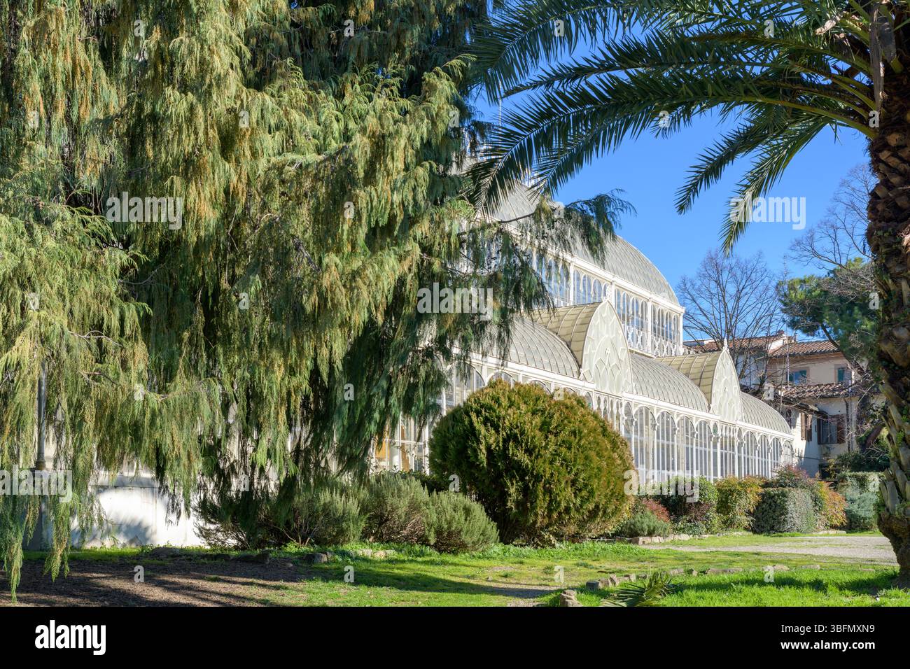 Historic glass and iron greenhouse in the Giardino dell'Orticultura, a ...