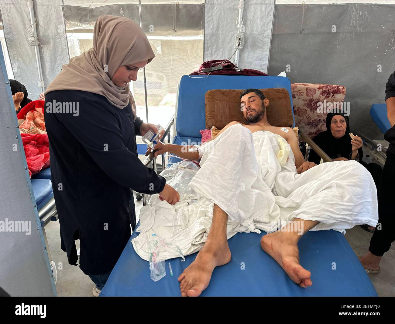 Wounded Palestinians receive medical care in Nasser Hospital Wounded Palestinians receive ...