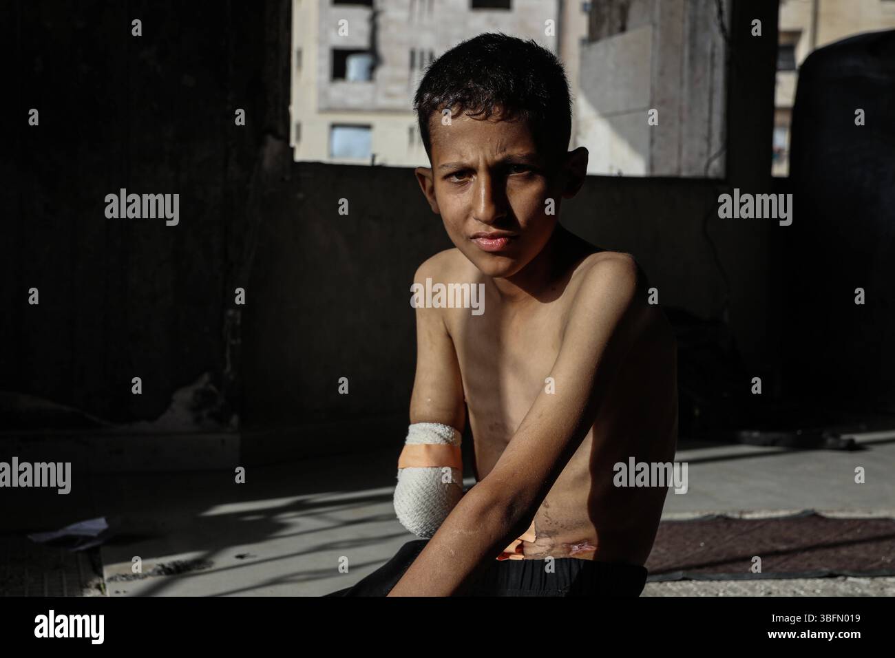 Ahmad Agha, a 14-year-old boy living in a shelter in Gaza City, who was ...