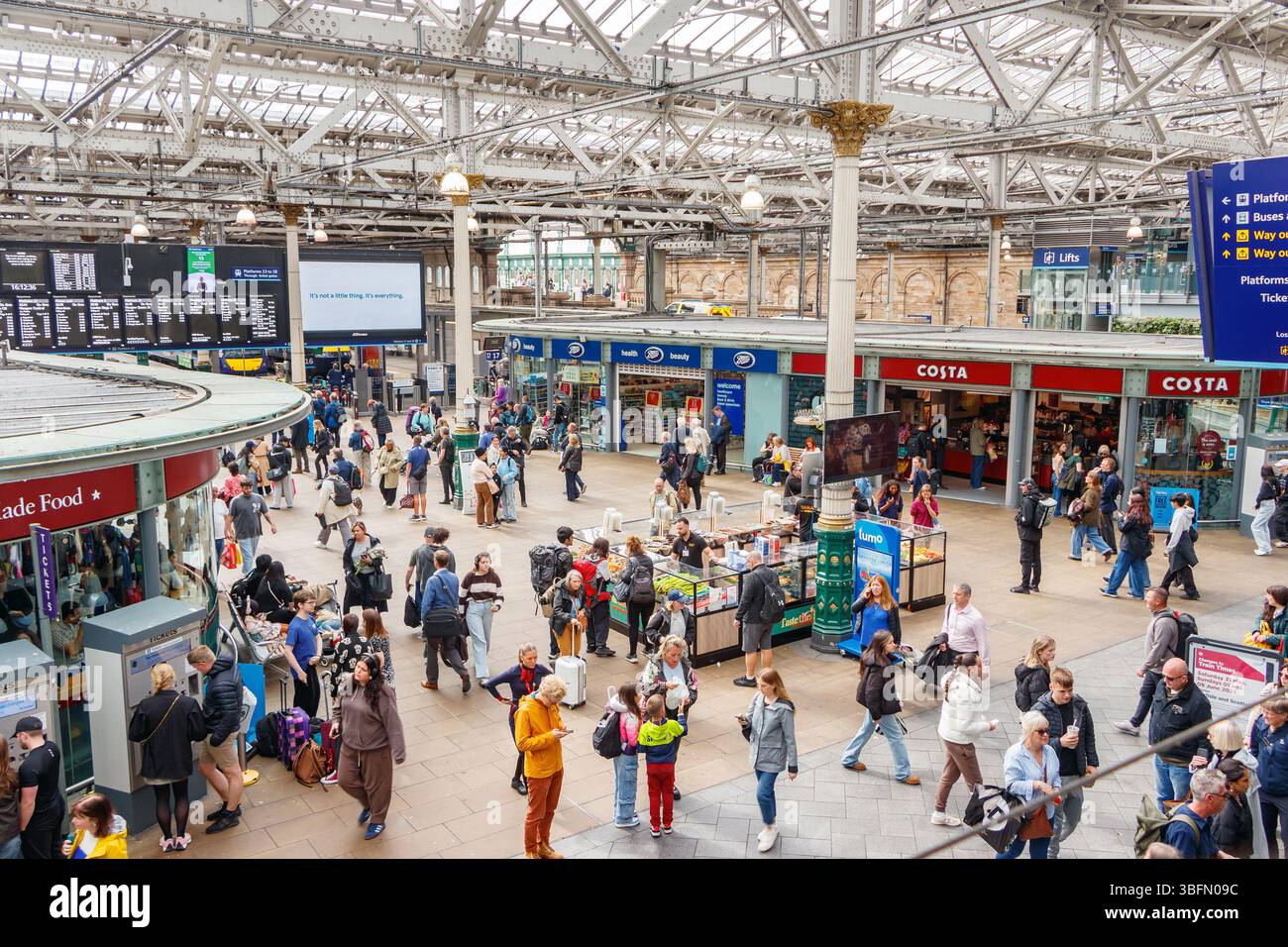 view of shops on concourse inside victorian edinburgh waverley rail ...