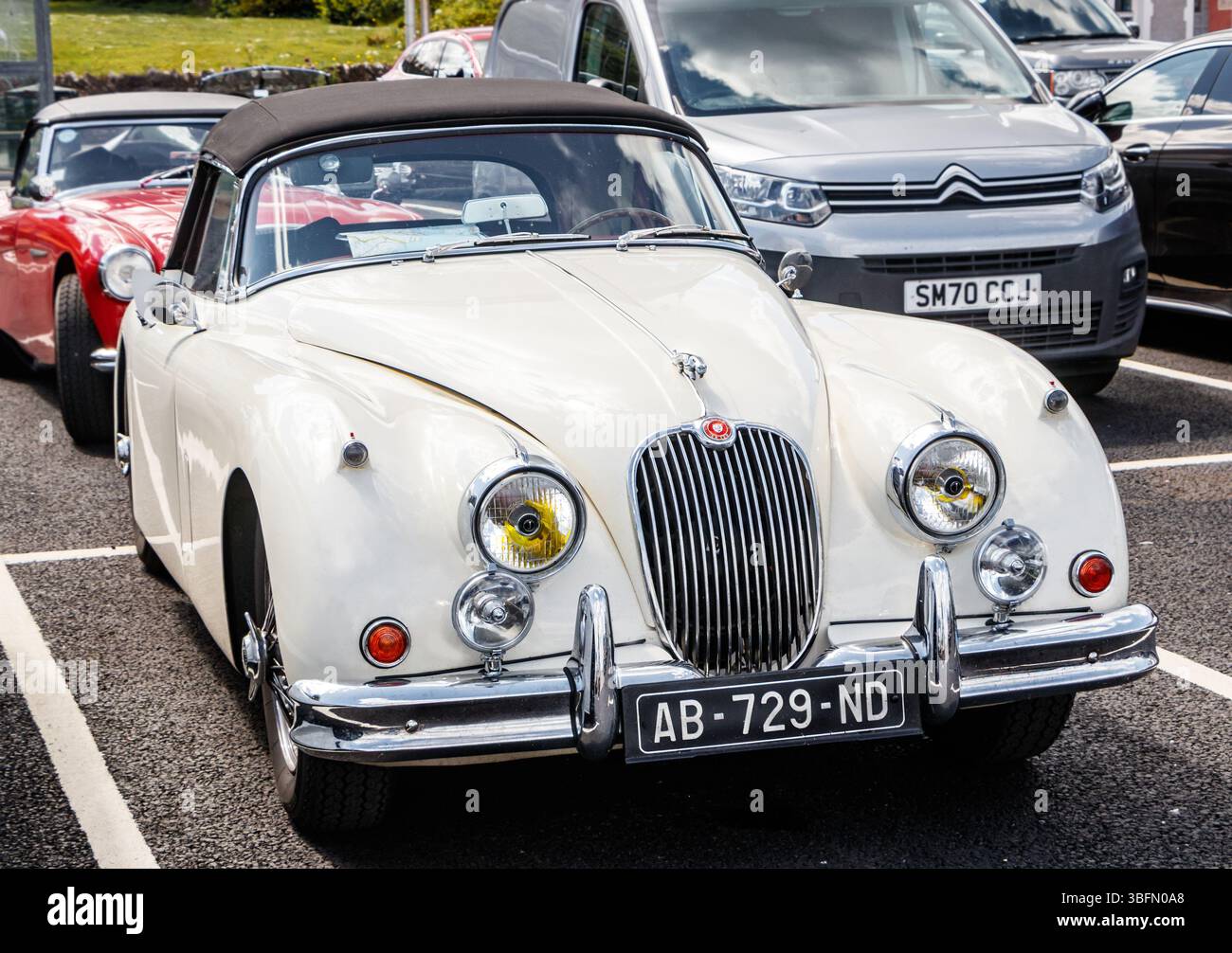Front view of classic vintage Jaguar XK150 white convertible sports car ...
