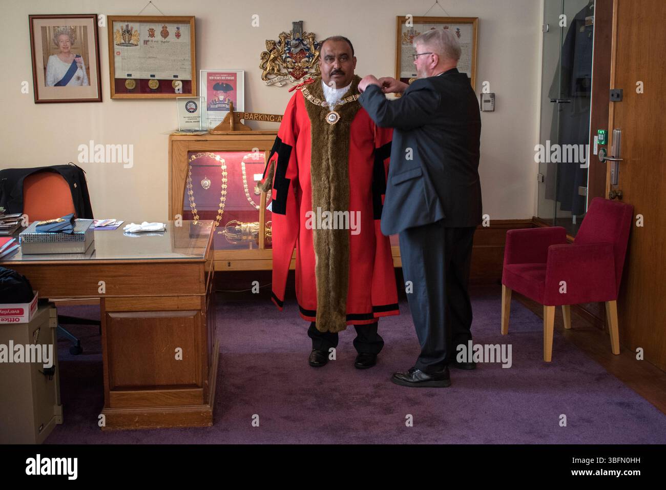 Muslim Mayor of Barking Councillor Abdul Aziz getting robed up in the ...