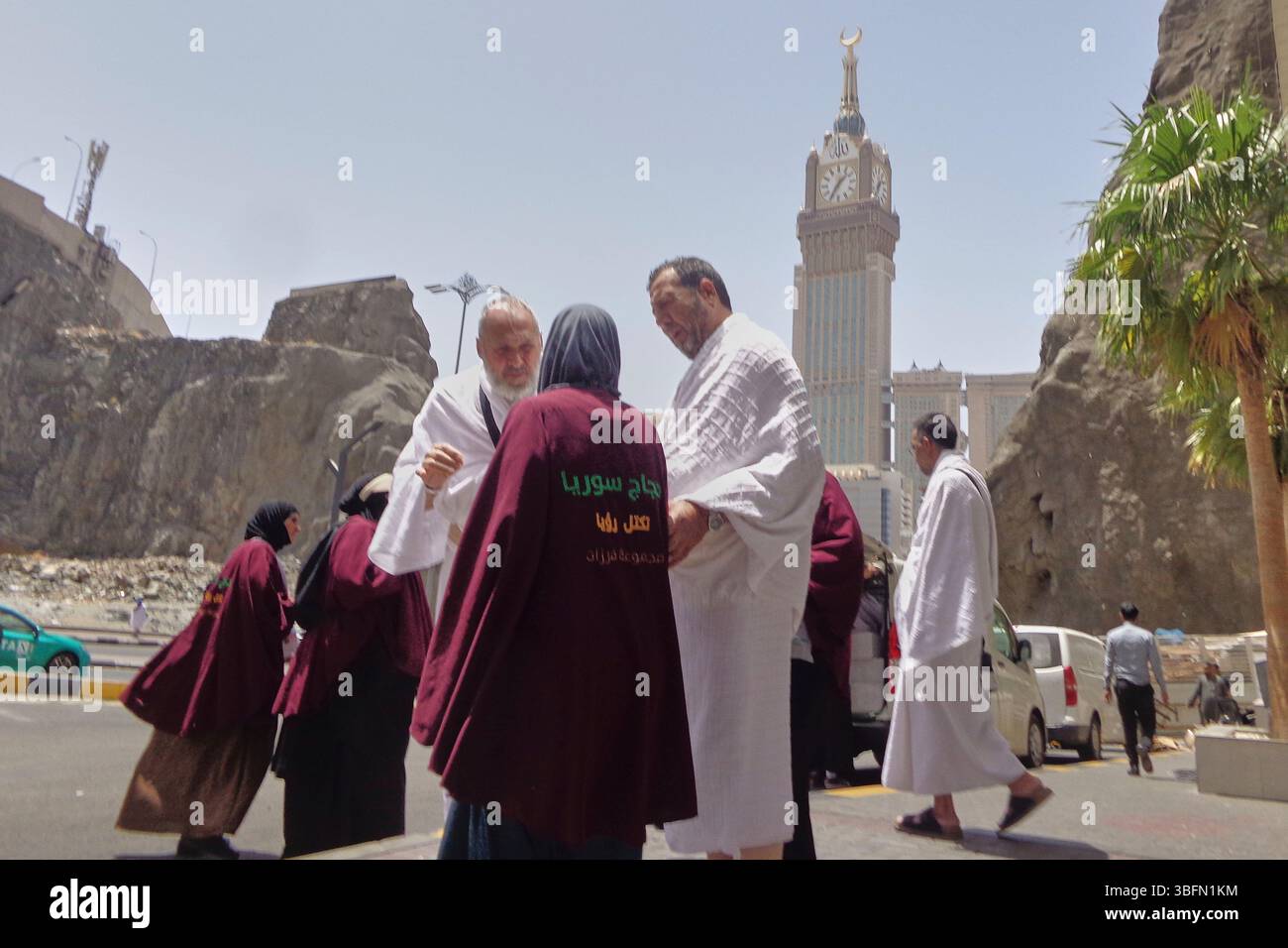 Syrian pilgrims chat outside their hotel near the Grand Mosque, during ...