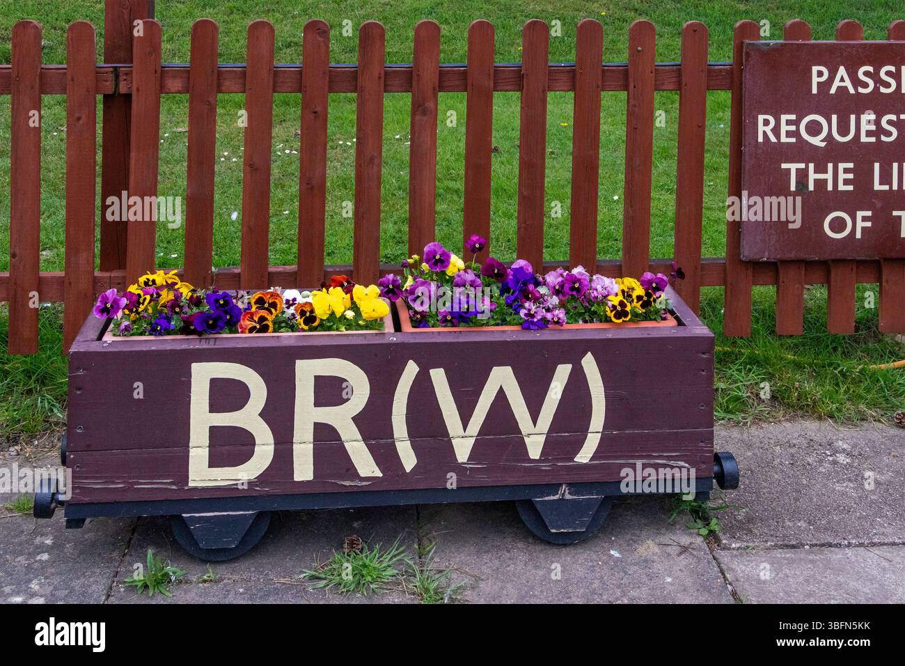 Flowers in small railway car, flower bucket, railway station ...