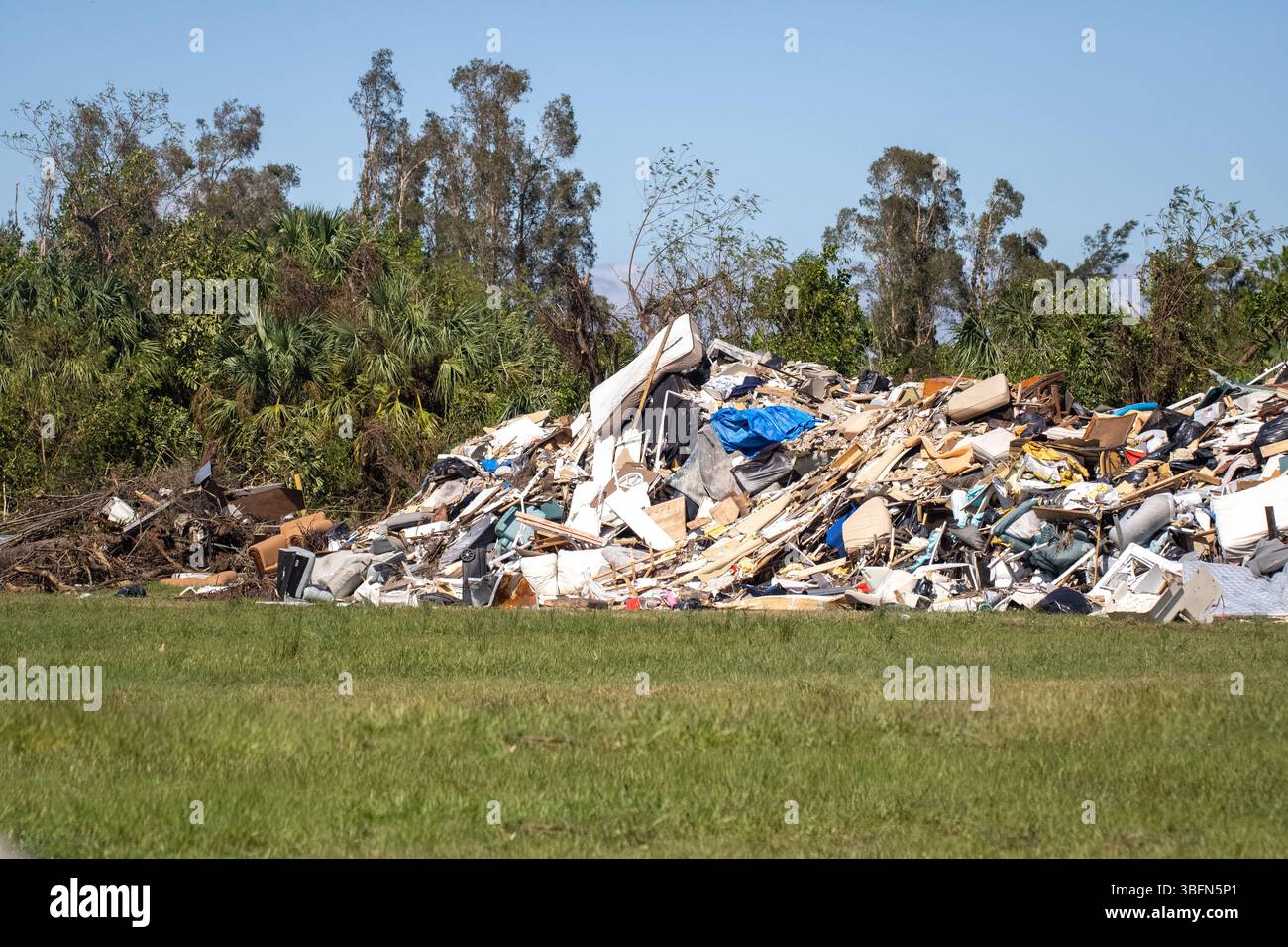 Garbage heap in clearing hurricane debris after a storm Stock Photo - Alamy