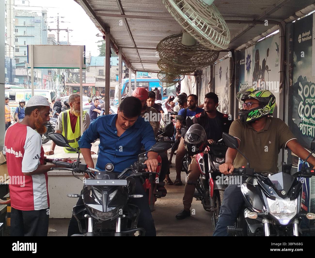 Dhaka, Bangladesh. 2nd June, 2025. An employee refuels a motorcycle at a gas station in Dhaka ...