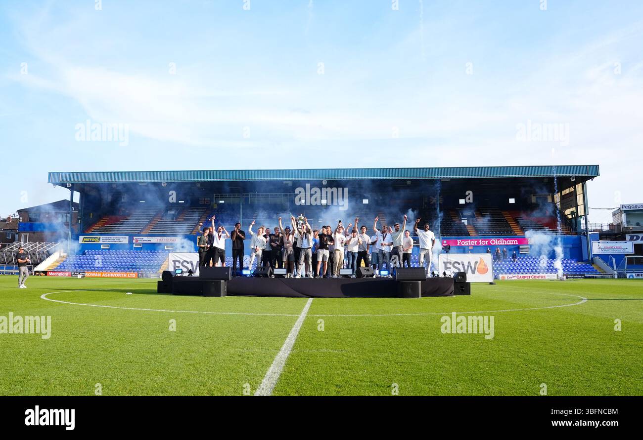 Oldham Athletic players lift the trophy during the Vanarama National ...