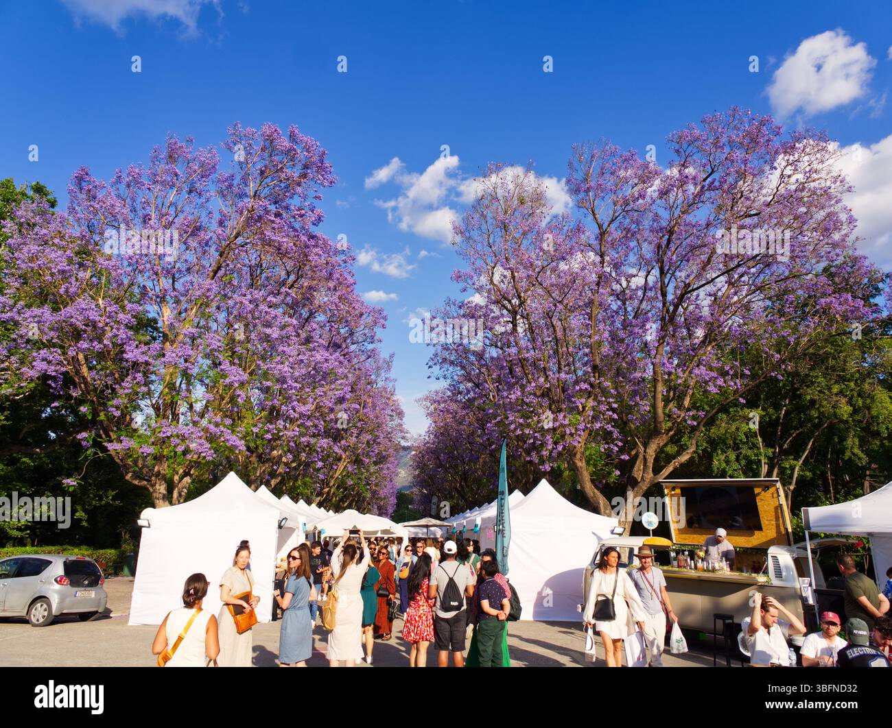 Athens, Greece - May 31 2025: Outdoor event with white tents and people ...