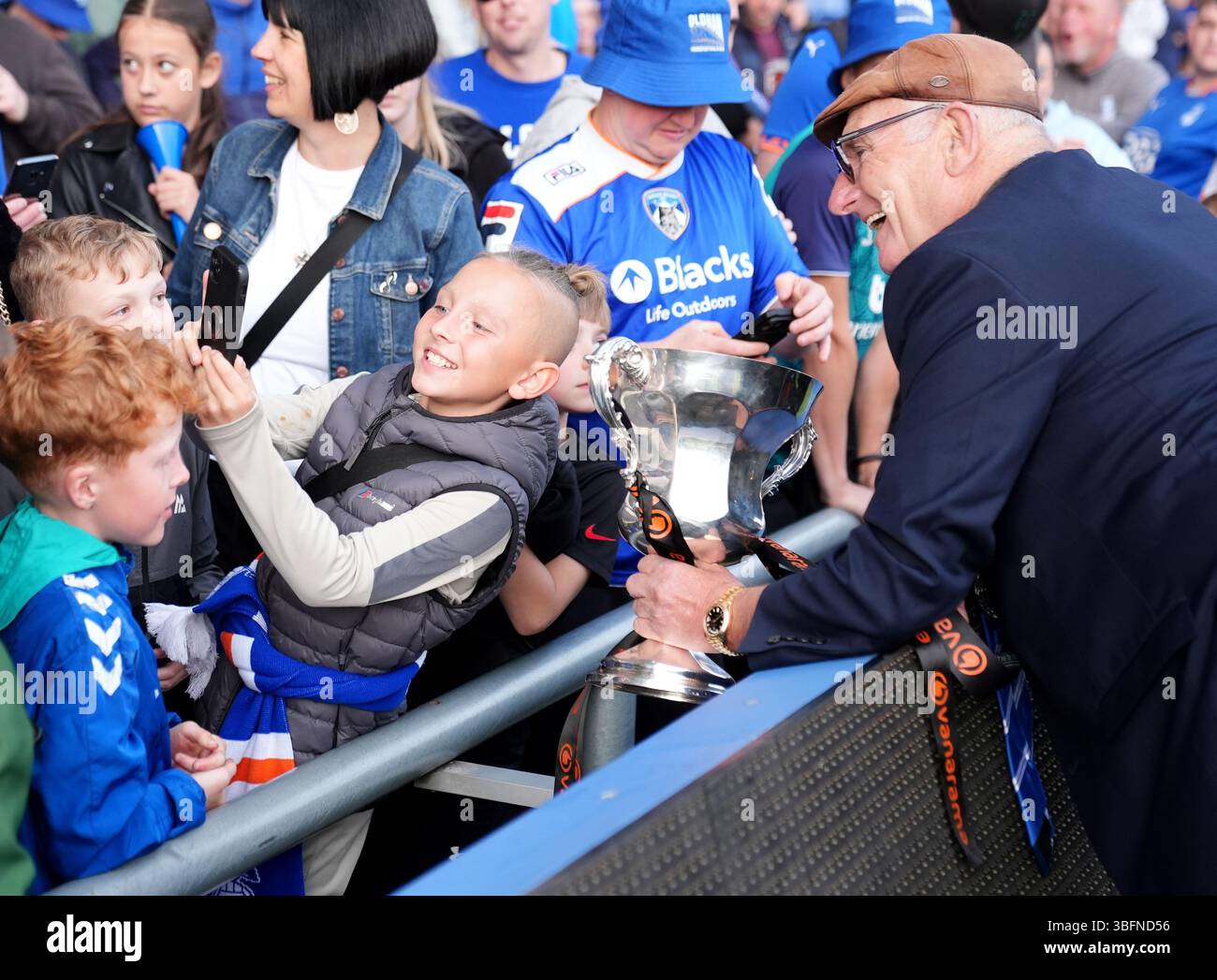 Oldham Athletic owner Frank Rothwell with the trophy during the ...
