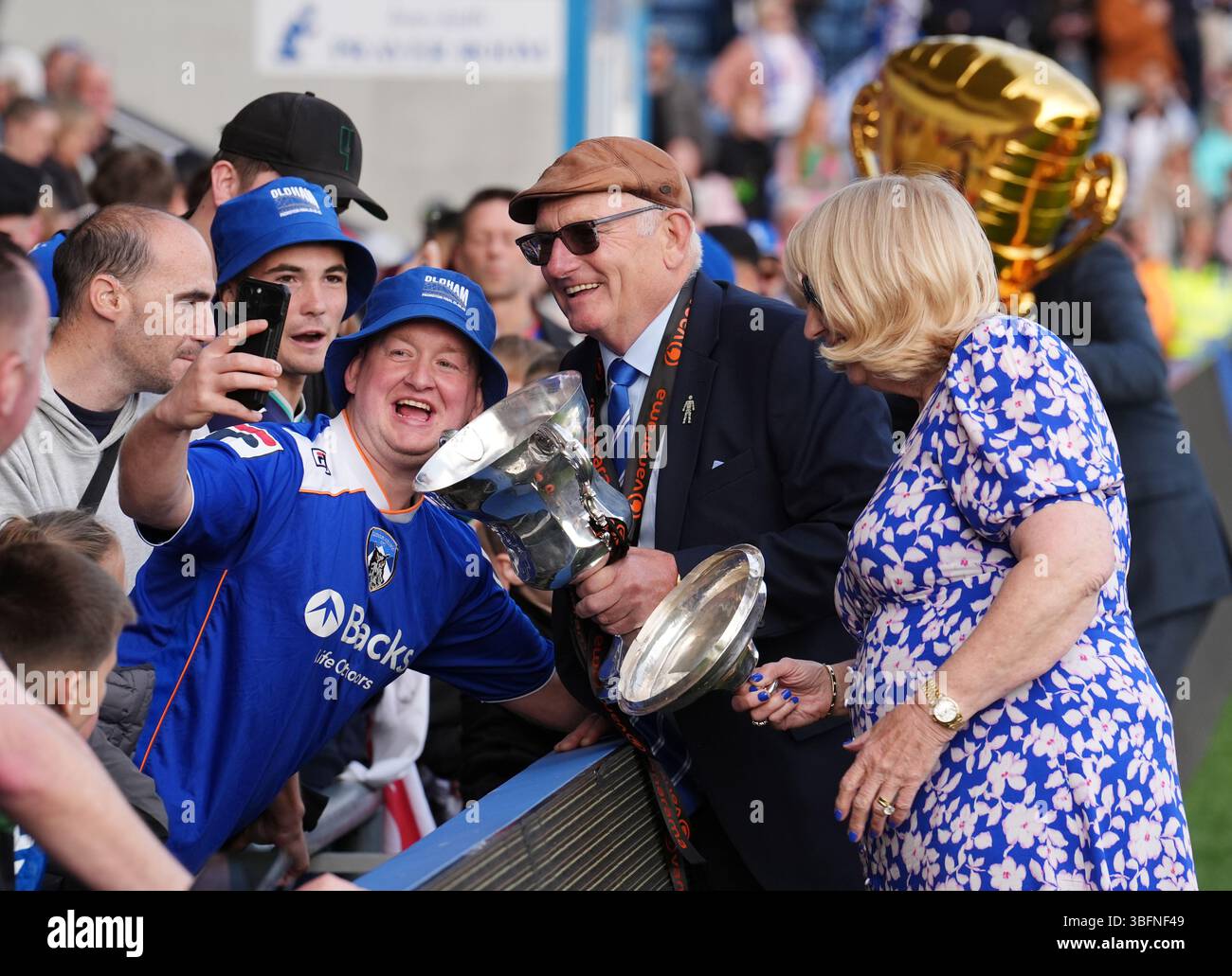 Oldham Athletic owner Frank Rothwell with the trophy during the ...