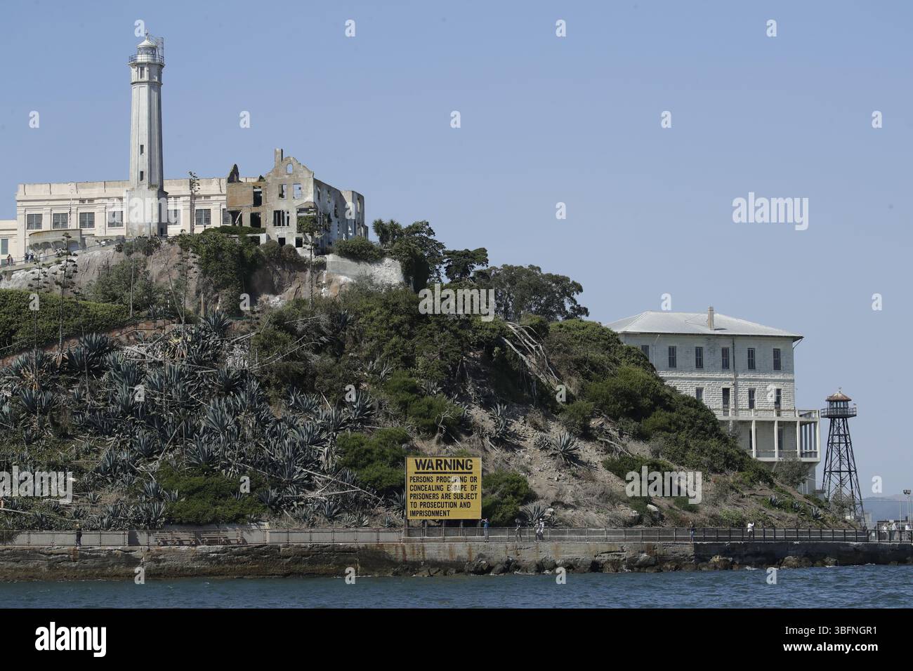 Lighthouse, guard tower, and warning sign seen on Alcatraz Island in ...